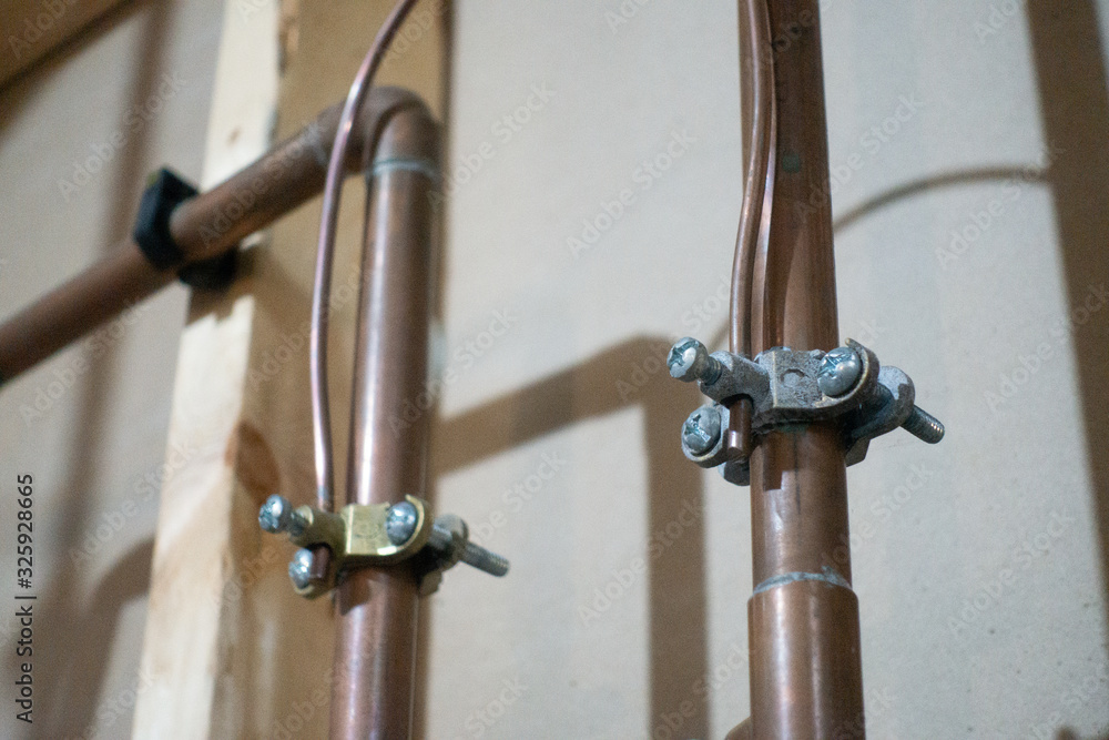electrical grounding and jumper cable on copper piping Stock Photo ...