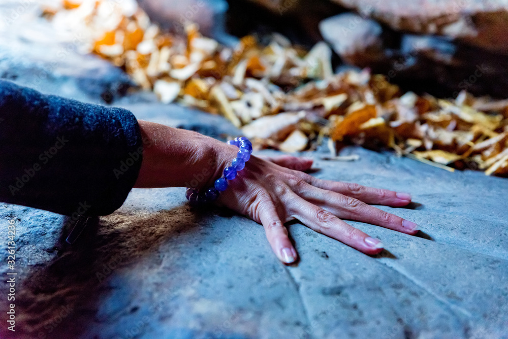 Female hand touches petroglyphs of the Bronze Age of Yamnaya culture ...