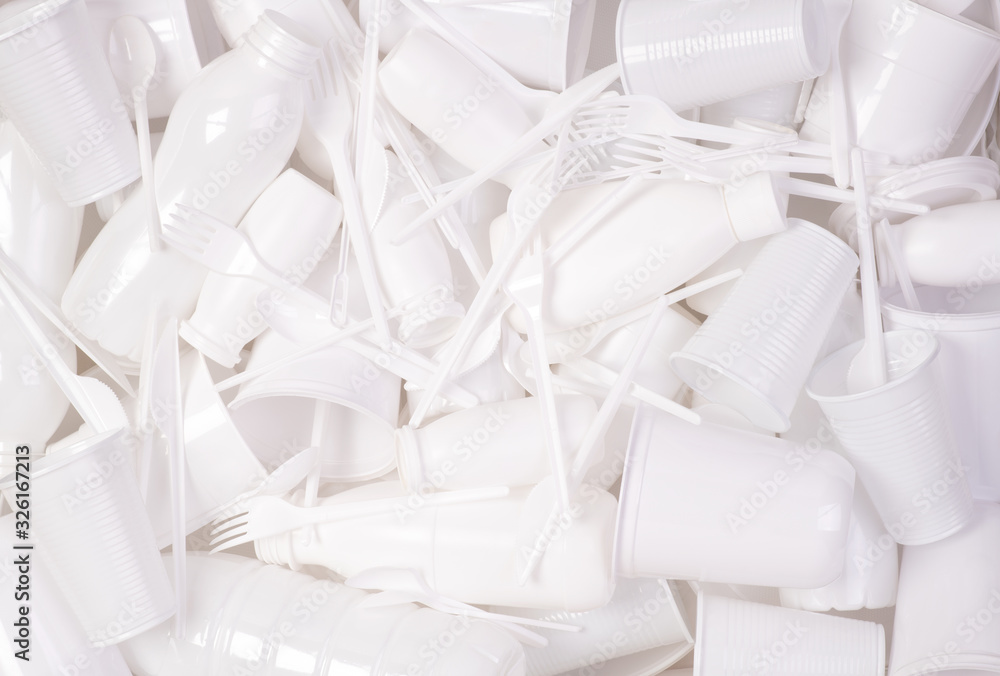 Disposable white single use plastic objects such as bottles, cups ...