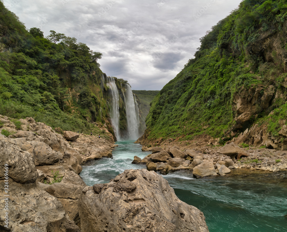 Green Background Scenic view of spectacular Tamul Waterfall, Tampaon ...