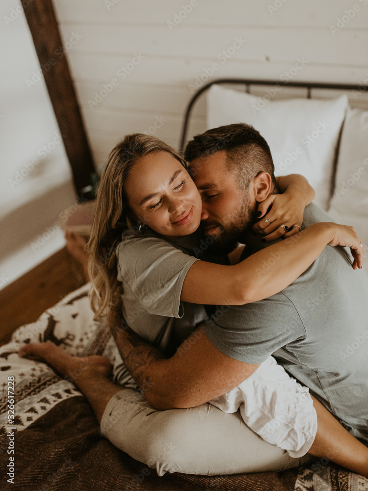 Beautiful loving couple kissing in bed Stock Photo | Adobe Stock
