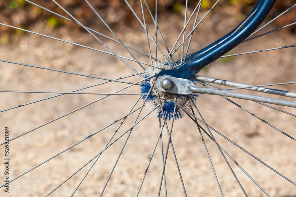 Bike Travel Closeup / Detail axis and spokes of used bicycle front ...