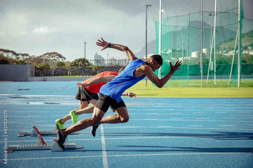 Athletes running at the stadium Stock Photo | Adobe Stock