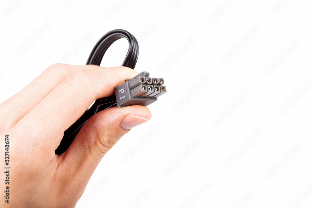 Hand holding up in fingers, presenting one single pc power supply unit ...