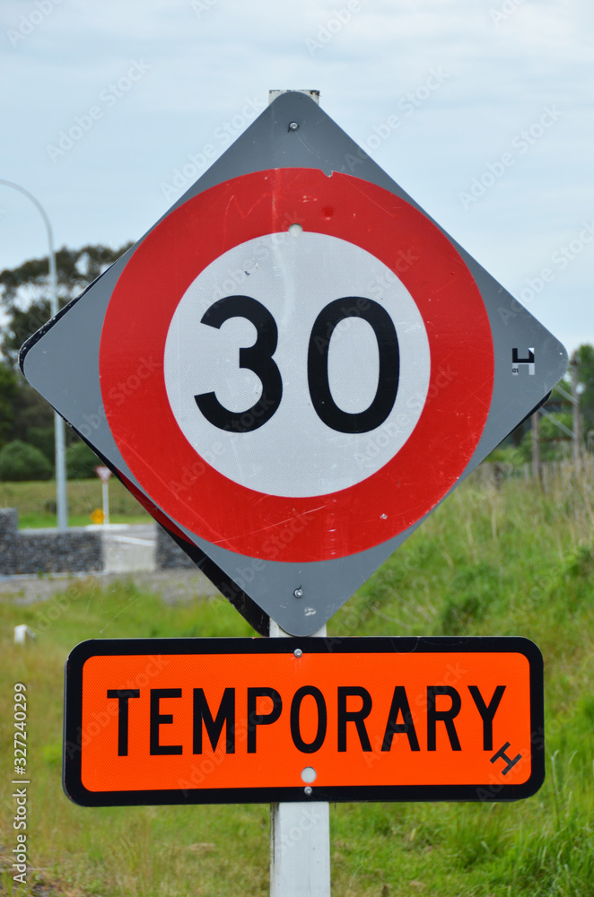 temporary speed limit sign, potrait Stock Photo | Adobe Stock