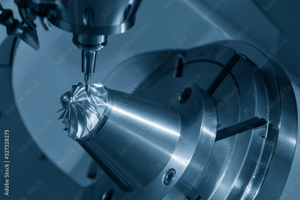 Stock-Foto „The 5-axis CNC milling machine cutting the aluminium ...