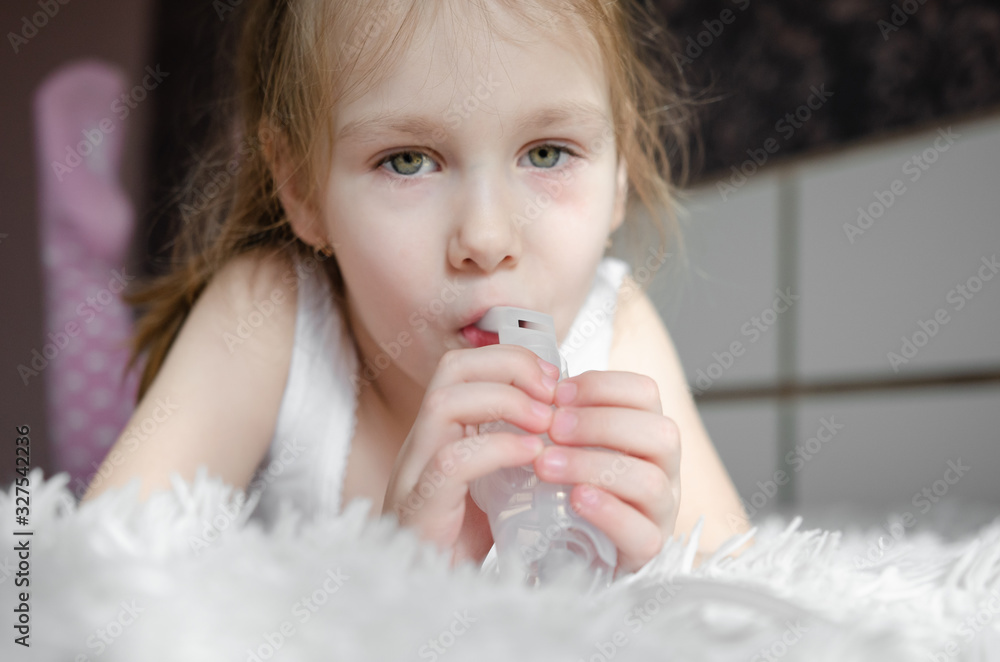 Cute little baby in the mask of an inhaler. Procedure of inhalation at ...