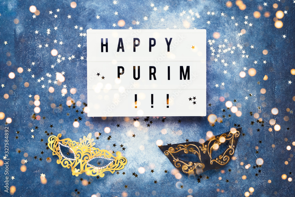 Flat lay of Purim Carnival celebration concept. Happy Purim written in ...