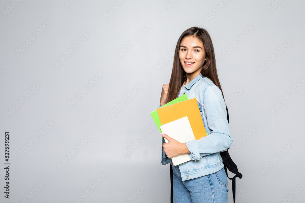 Portrait of attractive cute young student girl isolated on white ...