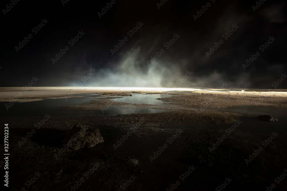 abstract mars like terrain with muddy puddles of water textures, rocks ...