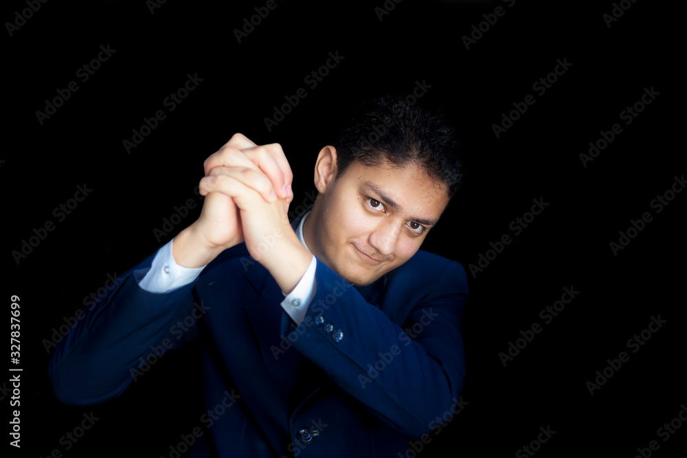 Portrait shot of young CEO/Entrepreneur isolated on black background ...