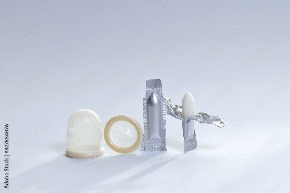 Foto de Stock Package and opened packaging of suppository and a latex ...