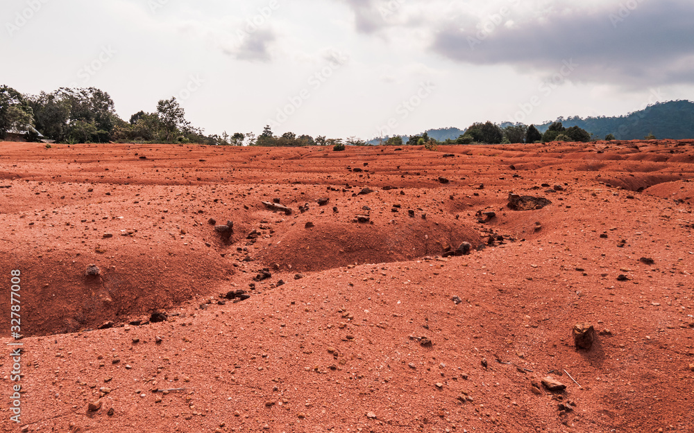 Grunge texture of red soil on tropical hills in rural Indonesia ...