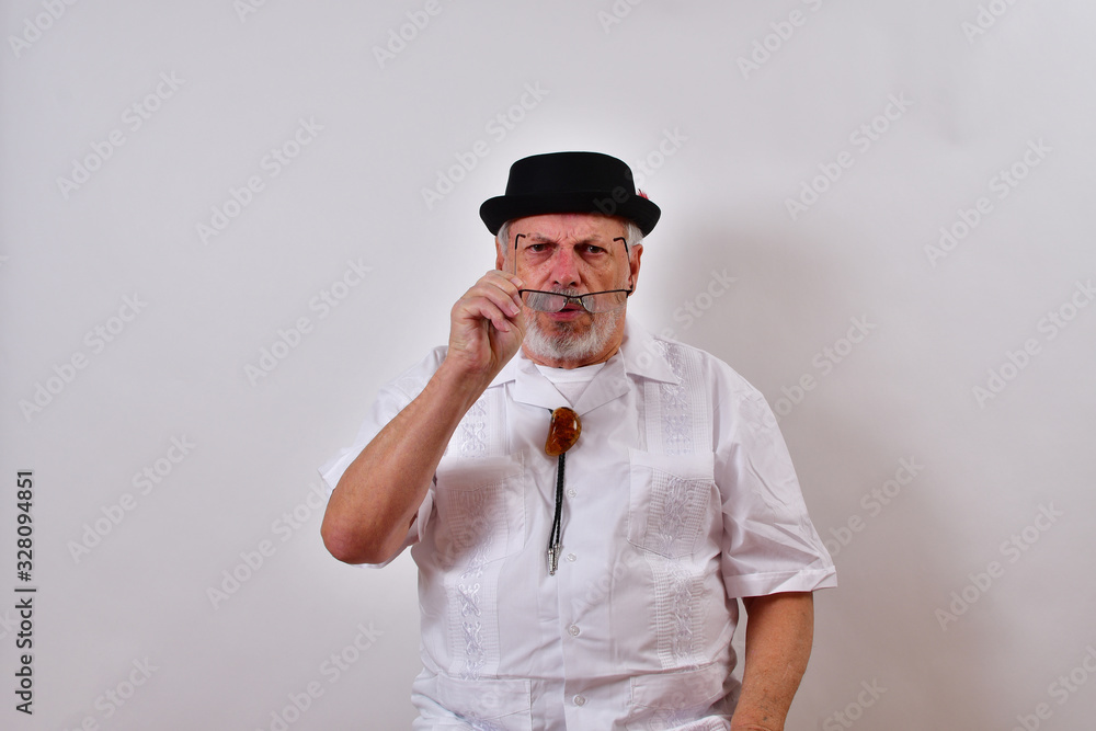 Old man taking off his glases.Elderly gentleman removes his spectacles ...