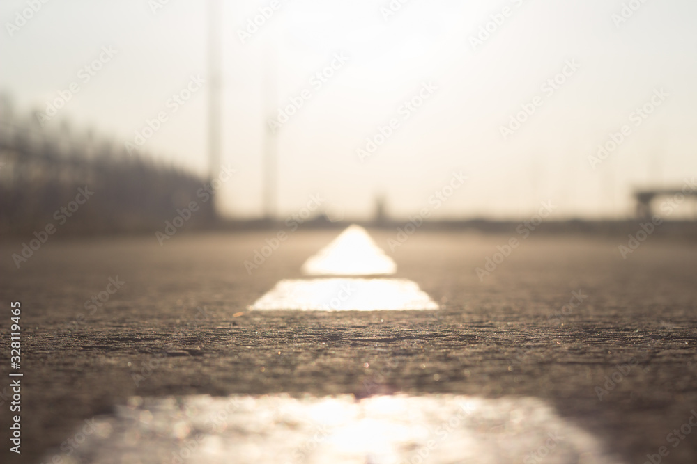 road markings go beyond the horizon. dividing line on the asphalt ...