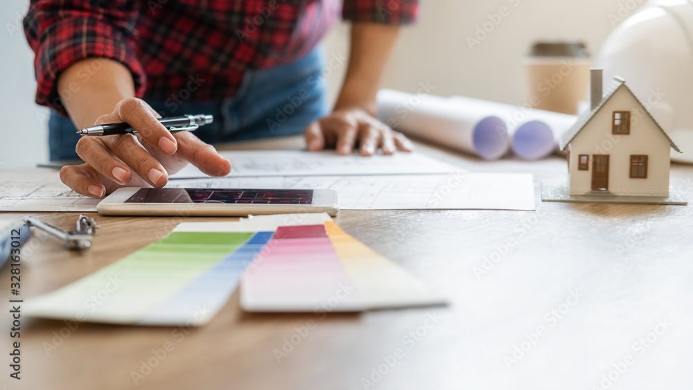 Interior designer choosing color in color swatch samples chart for ...