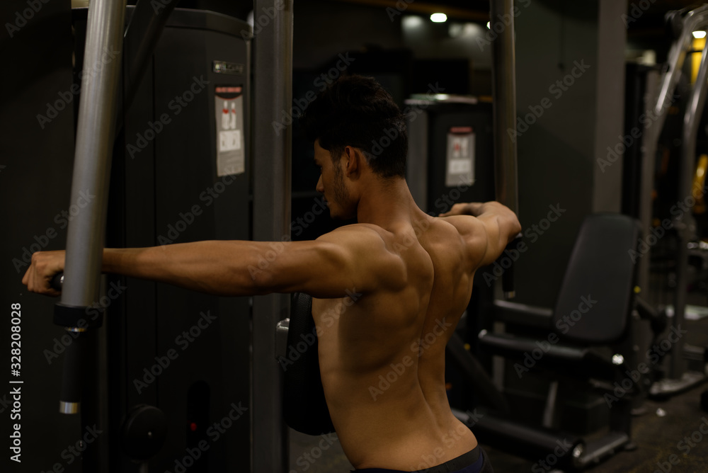An young and handsome Indian Bengali brunette man with muscular body ...