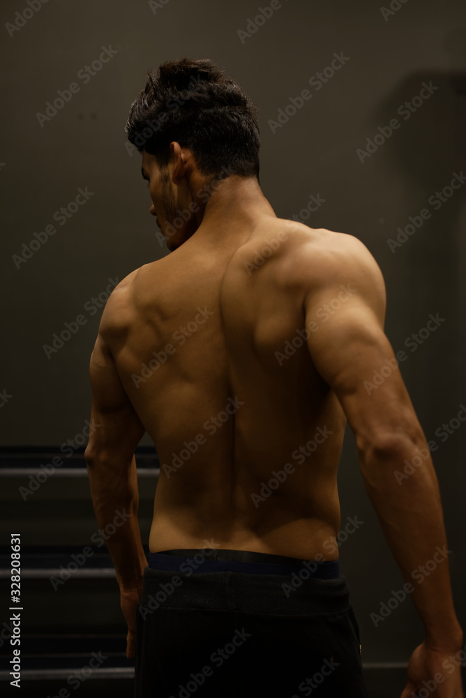 An young and handsome Indian Bengali brunette man with muscular body ...