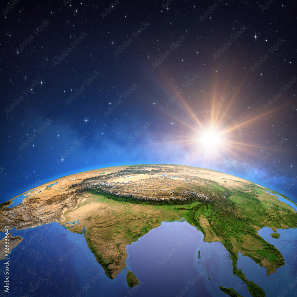 Sun shining over East Asia from space. Physical map of Himalayas ...