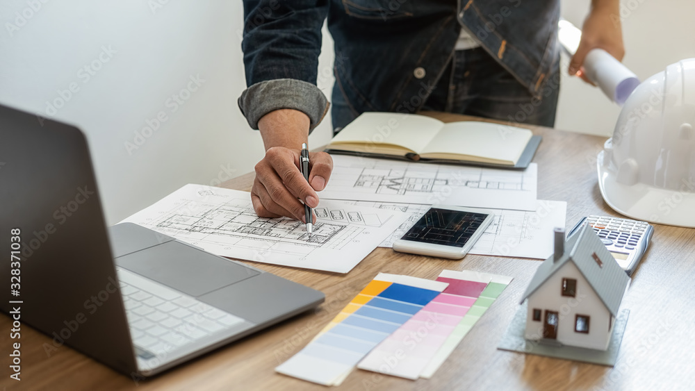 Interior designer choosing color in color swatch samples chart for ...