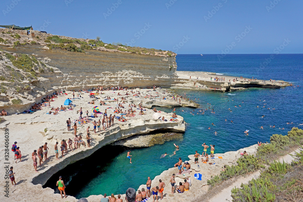 Crowds gather to swim in the naturally formed St. Peter’s Pool near ...