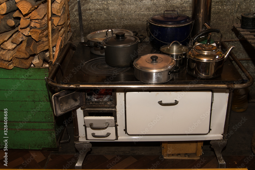 White wood stove with many holes on top, perfect for heating the house ...