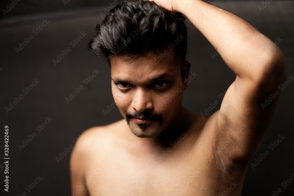 Face portrait of a confident muscular Indian brunette dark skinned ...