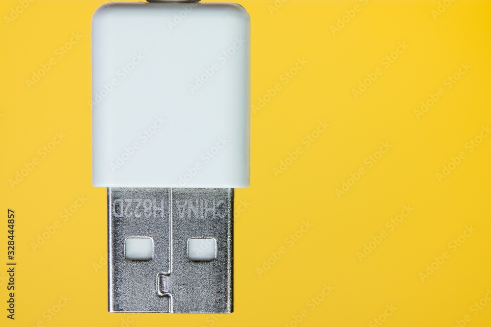 The face of usb cord head like a live robot on a yellow background ...
