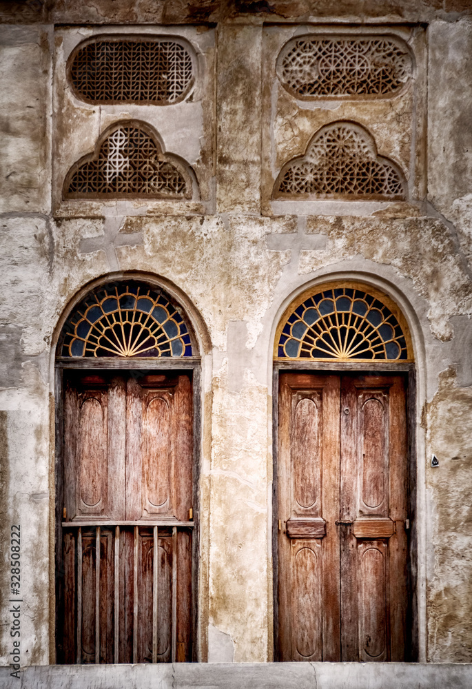 2 wooden old windows in the old capital of Bahrain, Muharraq old city ...