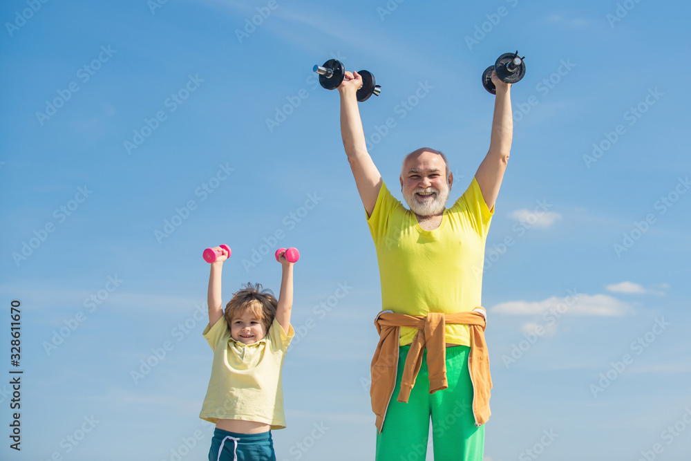 Grandfather and child is doing sport outdoors. Sport exercise for kids ...