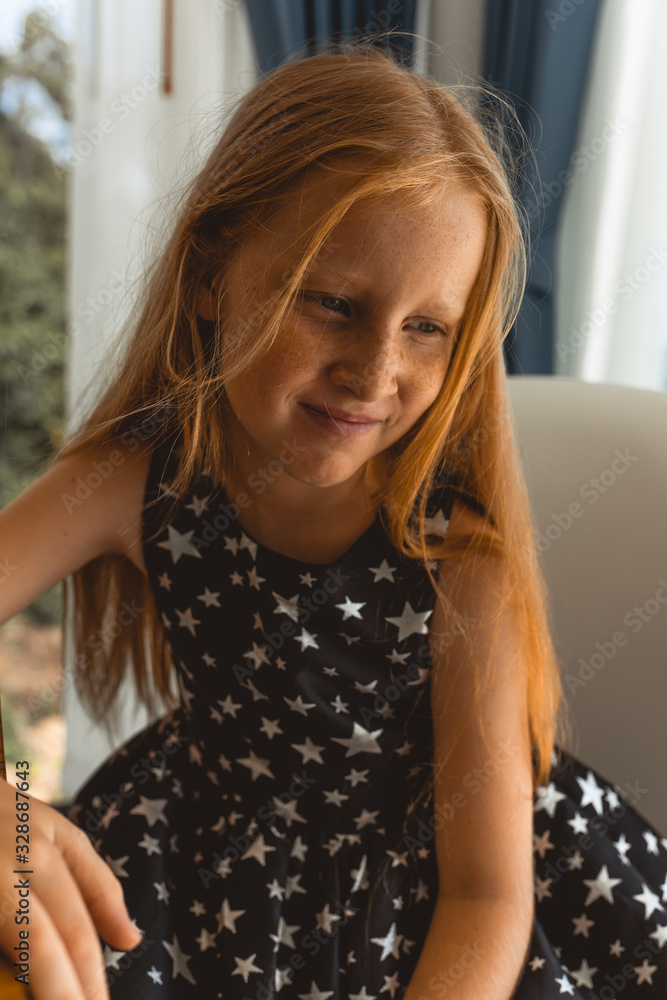 Little girl with red hair shows different emotions. Sadness, joy and ...