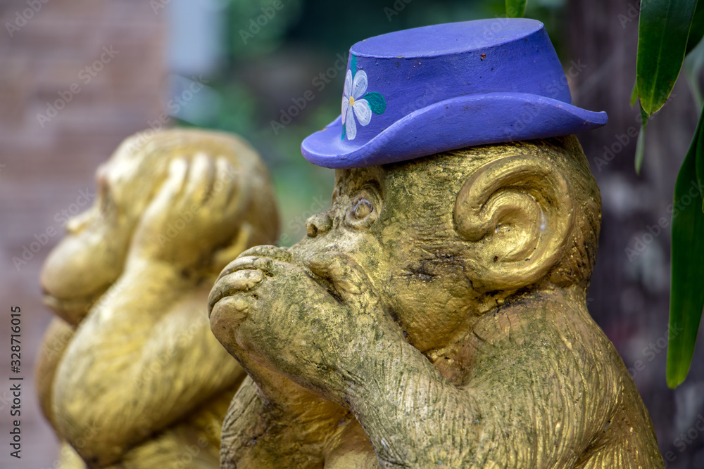 The figurine of Three wise monkeys at garden of Buddhist temple, Nakhon ...