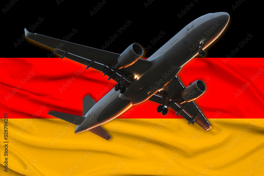 airplane on the background of the silk national flag of the modern ...