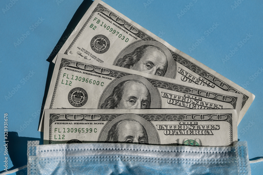 Medical masks and 100 dollars bills as a symbol of higher prices for ...