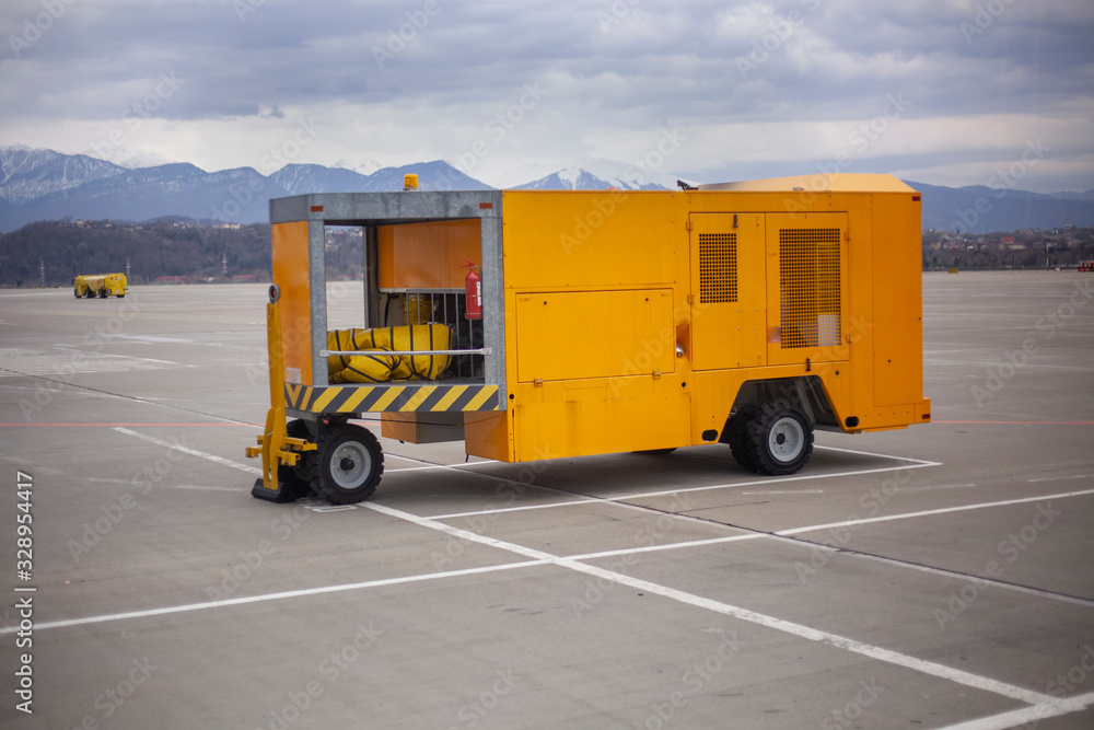 Special vehicles on the runway. Loader at the airport. A special ...