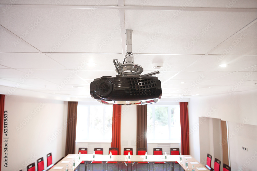 Projector on the ceiling. Interior of empty modern meetingroom ...