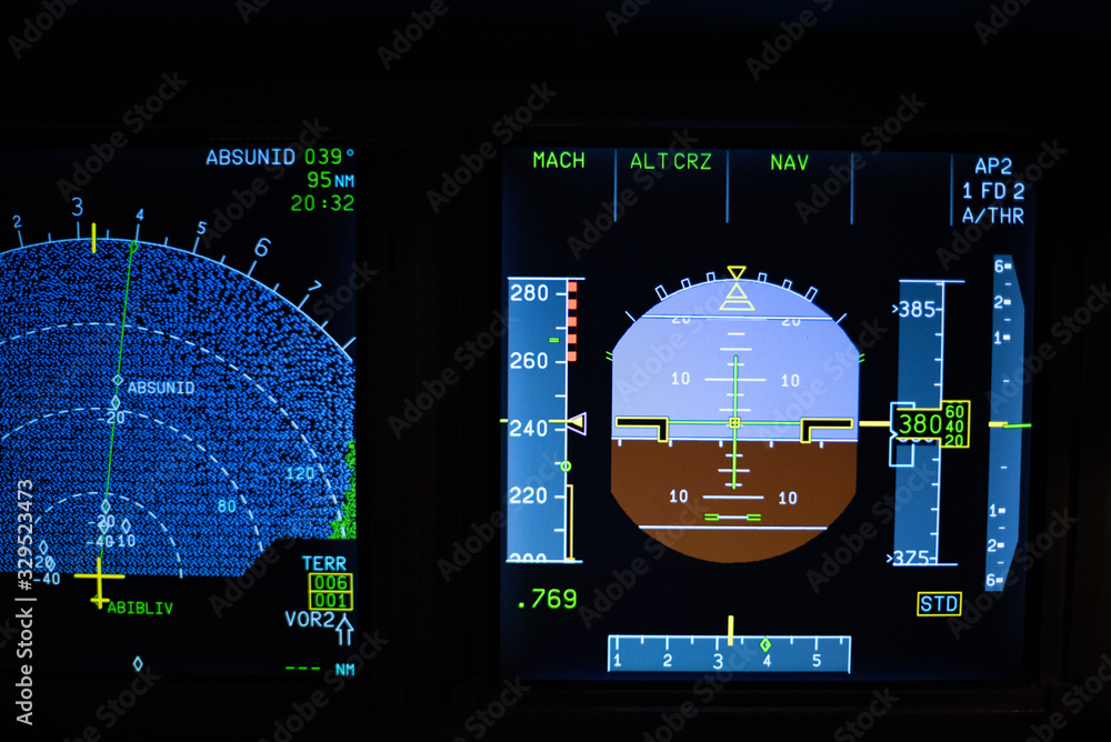 Primary flight display and navigation display at night of an Airbus A320, altitude, speed and ...