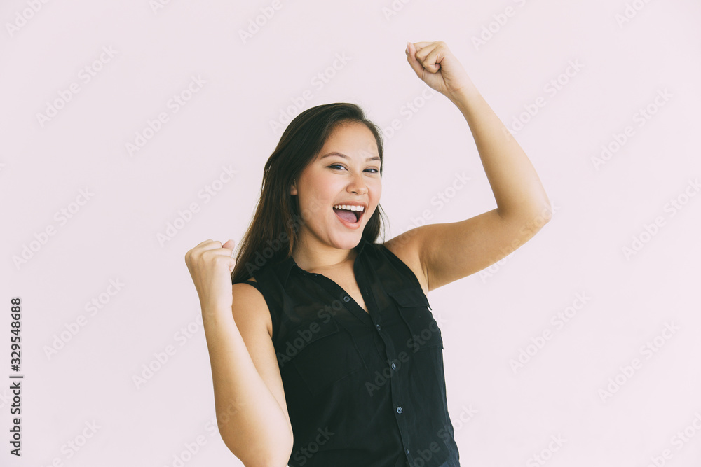 Happy excited teenage girl making winner gesture, celebrating success ...