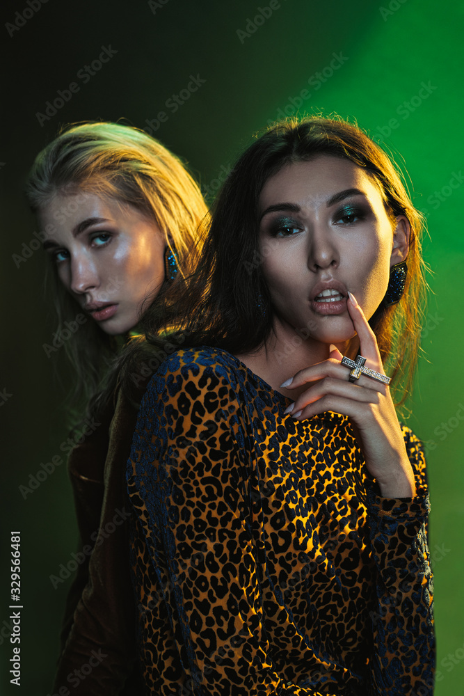 Fashion photo session in the studio. Beautiful woman model. Yellow ...