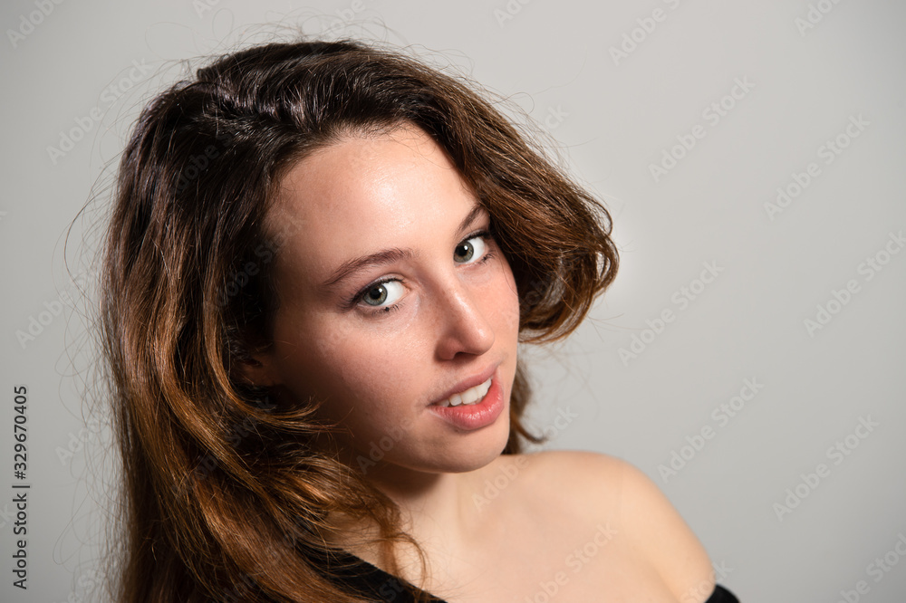 Sensual photo of young female model. Brunette girl with bared shoulder ...