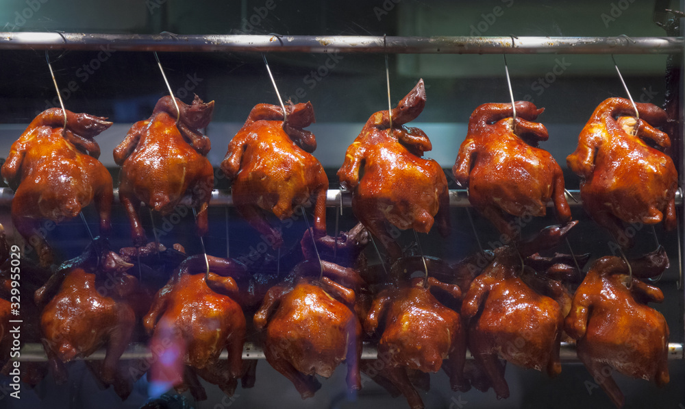 Delicious Soya Sauce Grilled Chickens hung on display in food box at ...