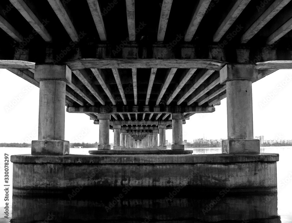 Bottom view of the reinforced concrete bridge over the river. Bridge ...