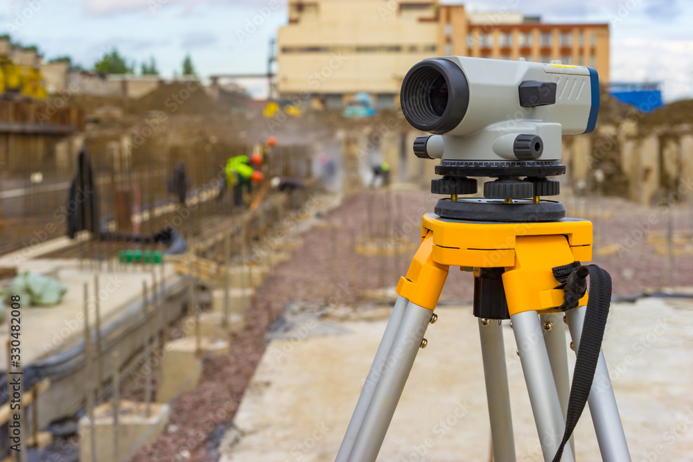 Stock-Foto „Theodolite close-up on the background of a construction ...