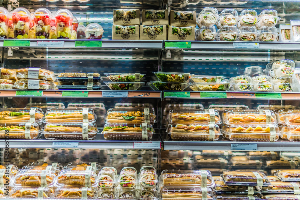 Pre-packaged foods displayed in a commercial refrigerator Stock Photo ...