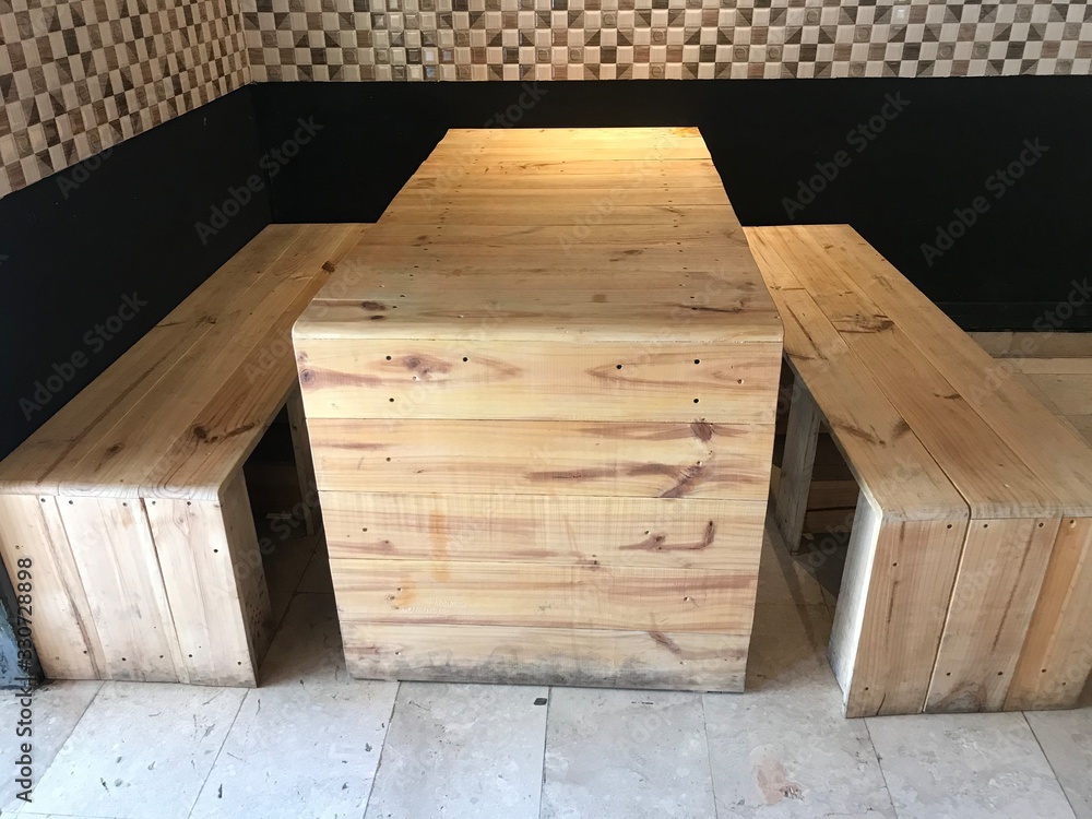 wooden benches and table fixed on the restaurant or hotel for customer ...