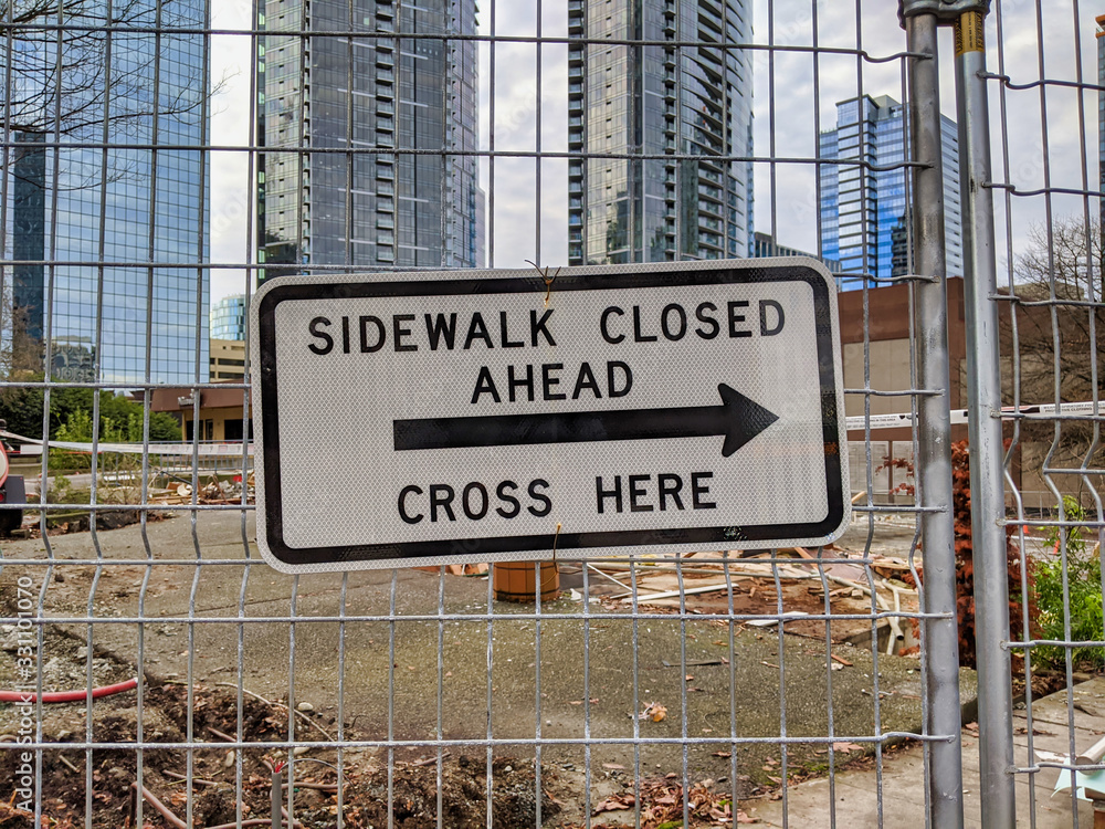 Sidewalk Closed Ahead Sign in front of Bellevue construction site at ...