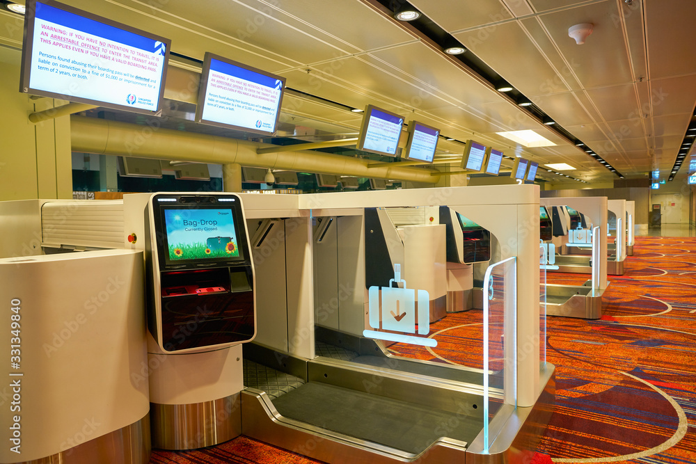 SINGAPORE - CIRCA APRIL, 2019: bag-drop facilities at Singapore Changi ...
