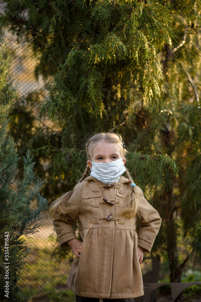 The concept of cvid-19 and air pollution. A young child's mask to ...