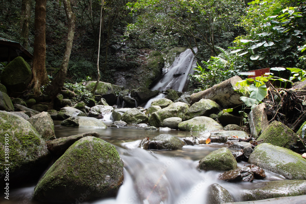 Waterfall at the rainforest of Sarawak, Borneo, Malaysia. Water falls ...