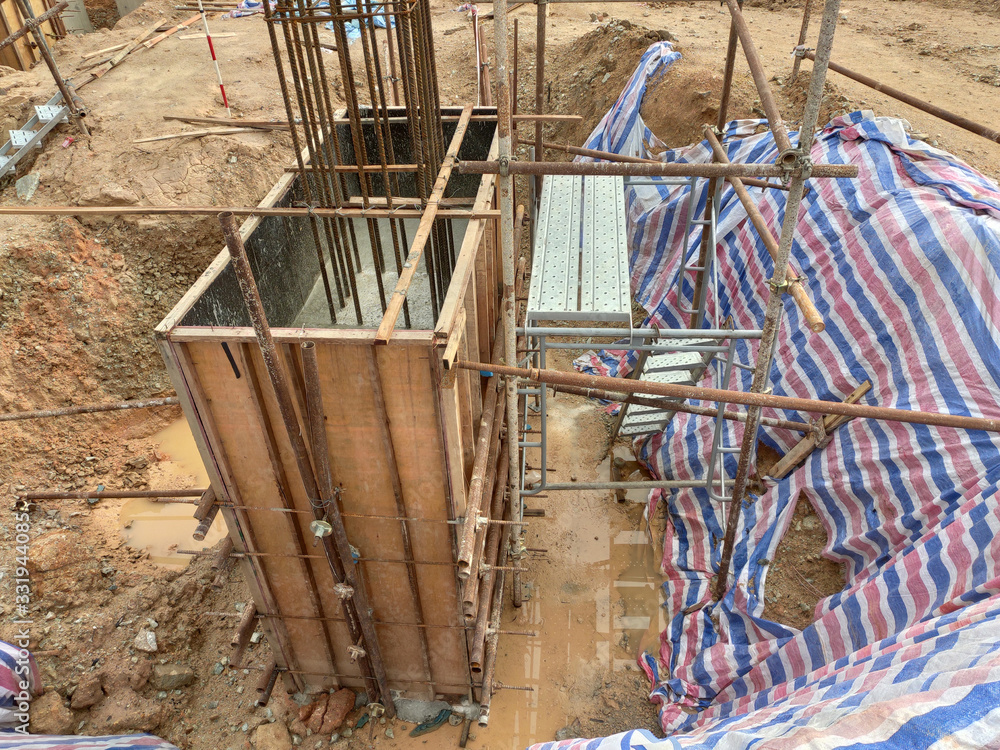 Pile cap and column stump under construction at the construction site ...
